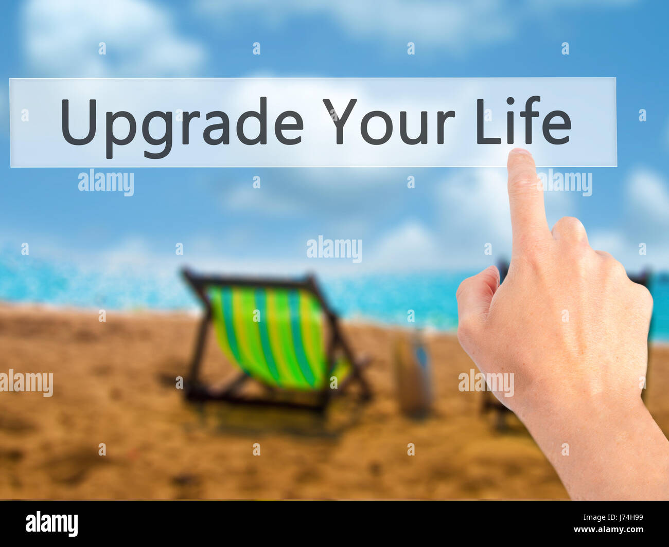 Upgrade Your Life - Hand pressing a button on blurred background ...