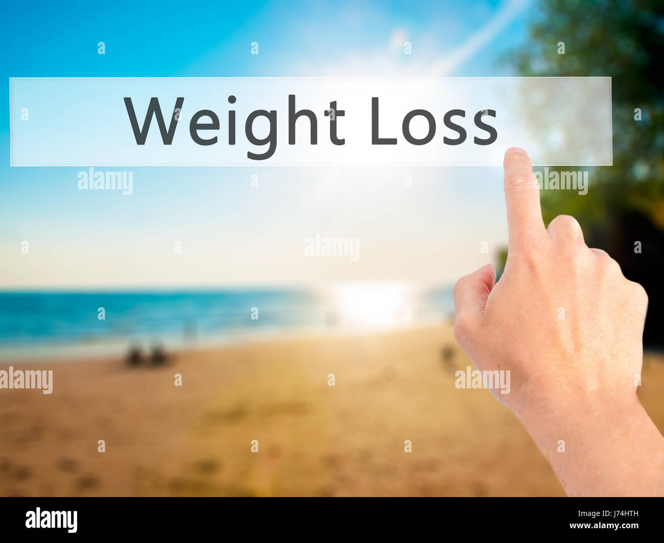 Weight Loss - Hand pressing a button on blurred background concept ...