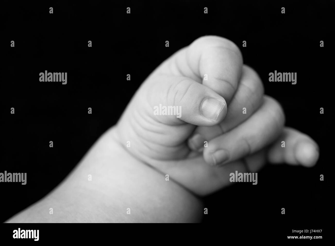 Hand tiny Black and White Stock Photos & Images - Alamy