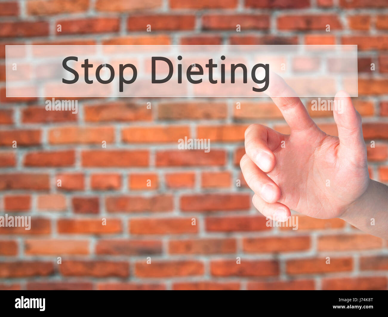 Stop Dieting - Hand pressing a button on blurred background concept ...