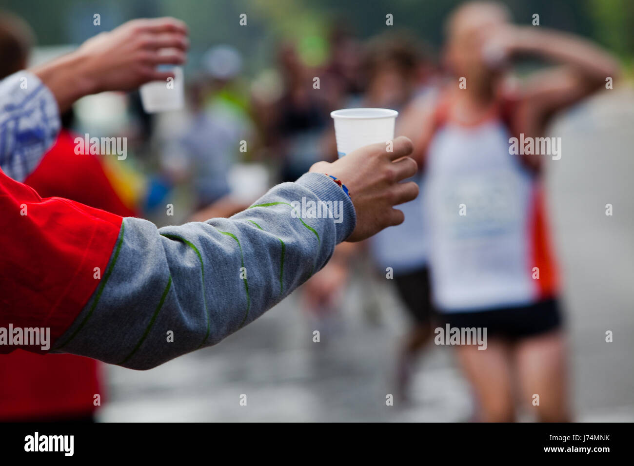 Marathon runner drink station hi-res stock photography and images - Alamy