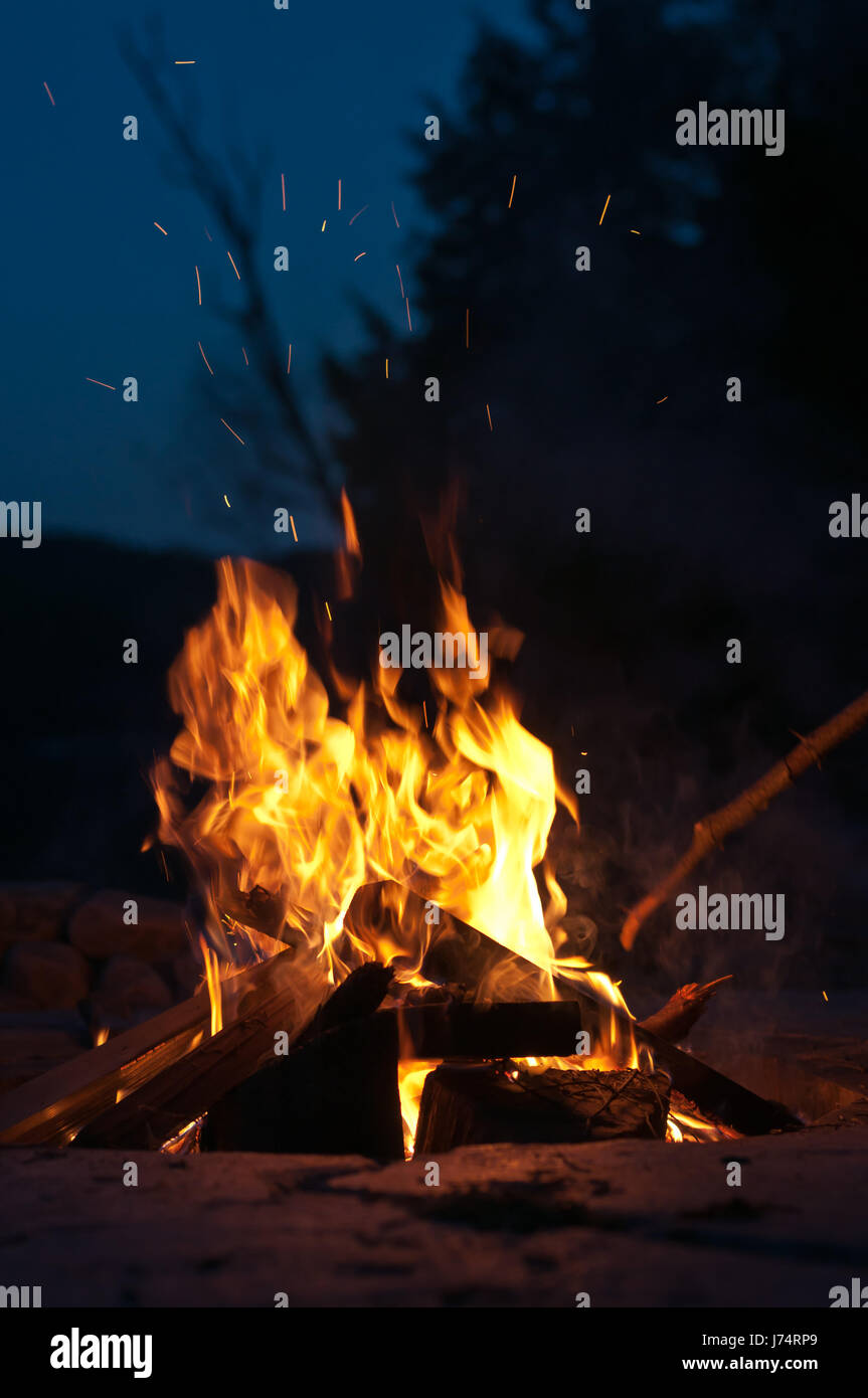 night nighttime fire conflagration flame flames campfire sparks wood ...