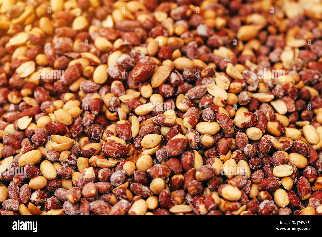 Pile of salted peanuts on street market selective focus Stock Photo - Alamy