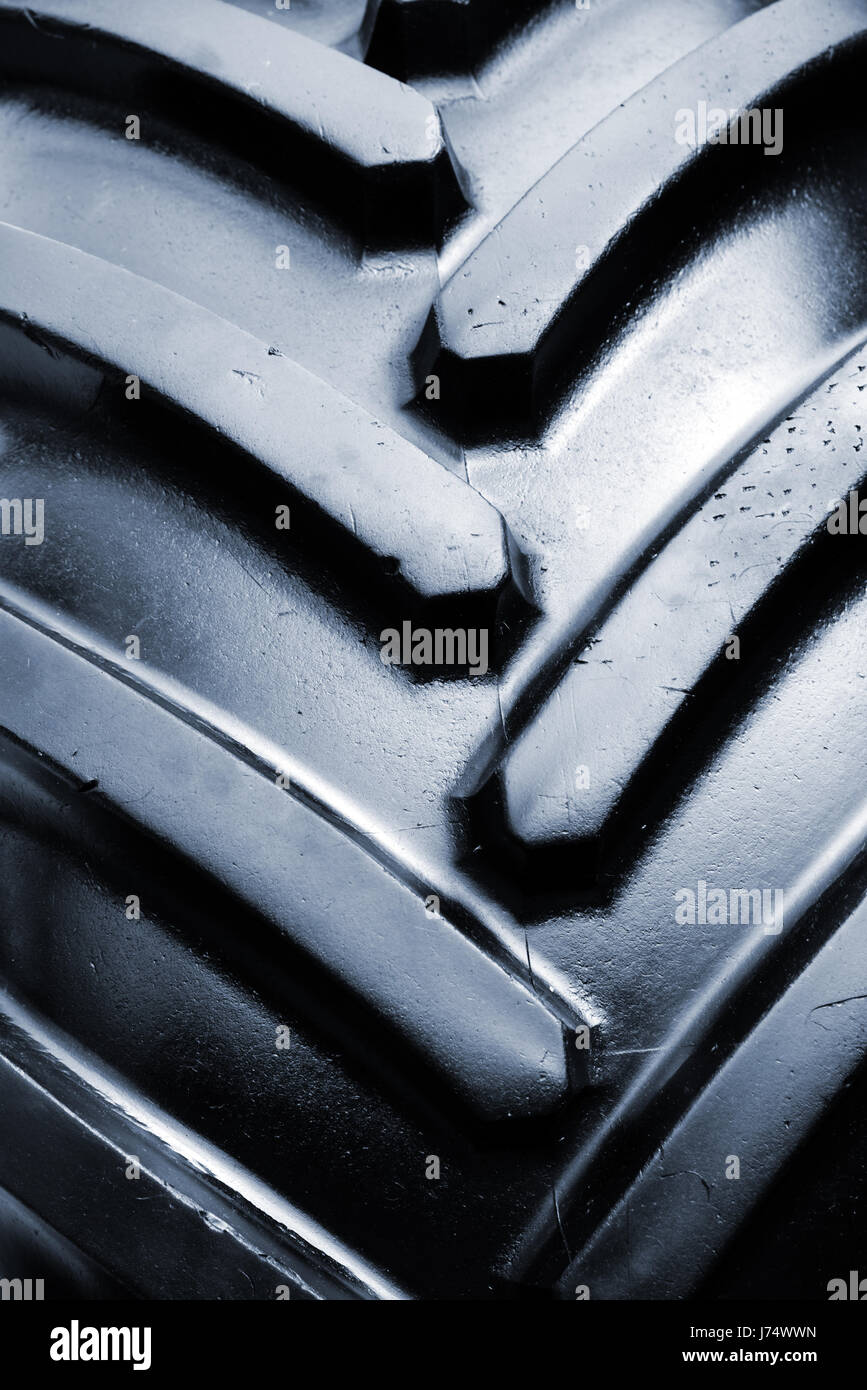 Tractor tire detail, close up of agricultural machinery rubber tyre ...