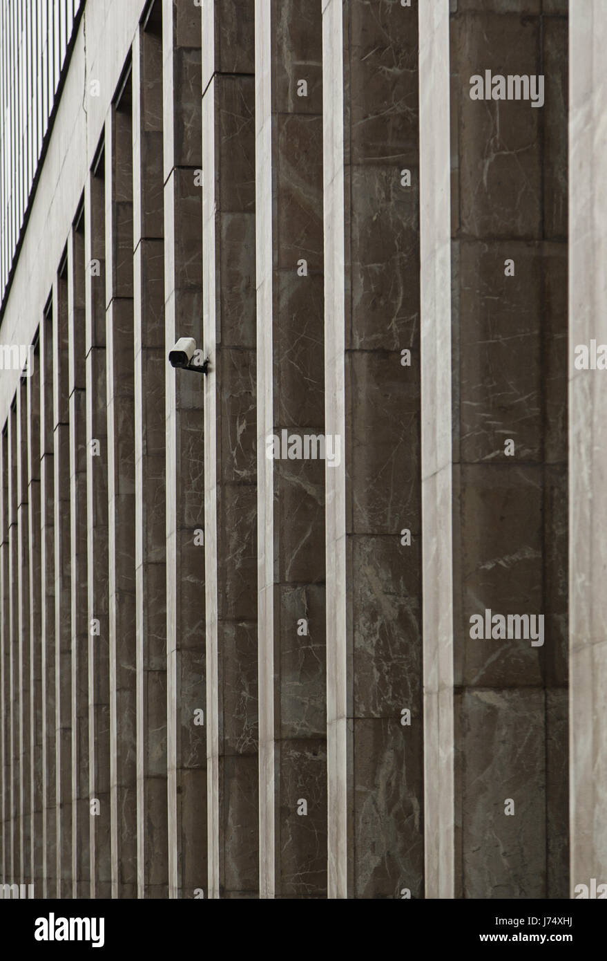 Surveillance camera in columns, detail of a facade in the city ...