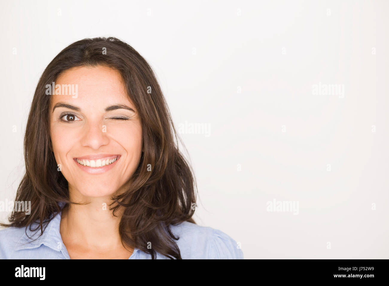 woman winking with the eye Stock Photo - Alamy