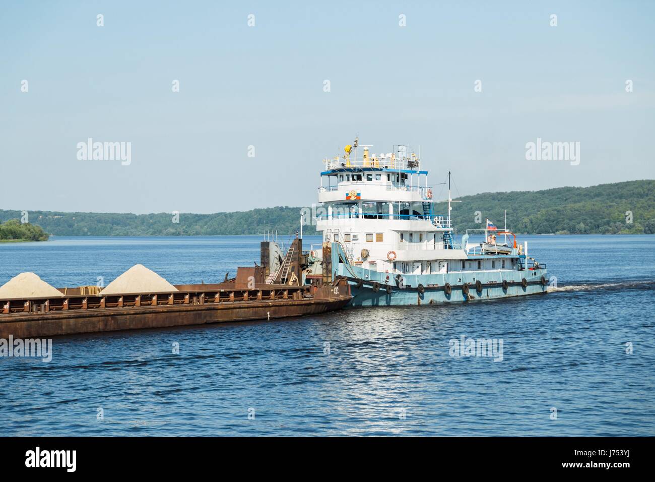 Cargo ship barge loaded with sand Stock Photo - Alamy