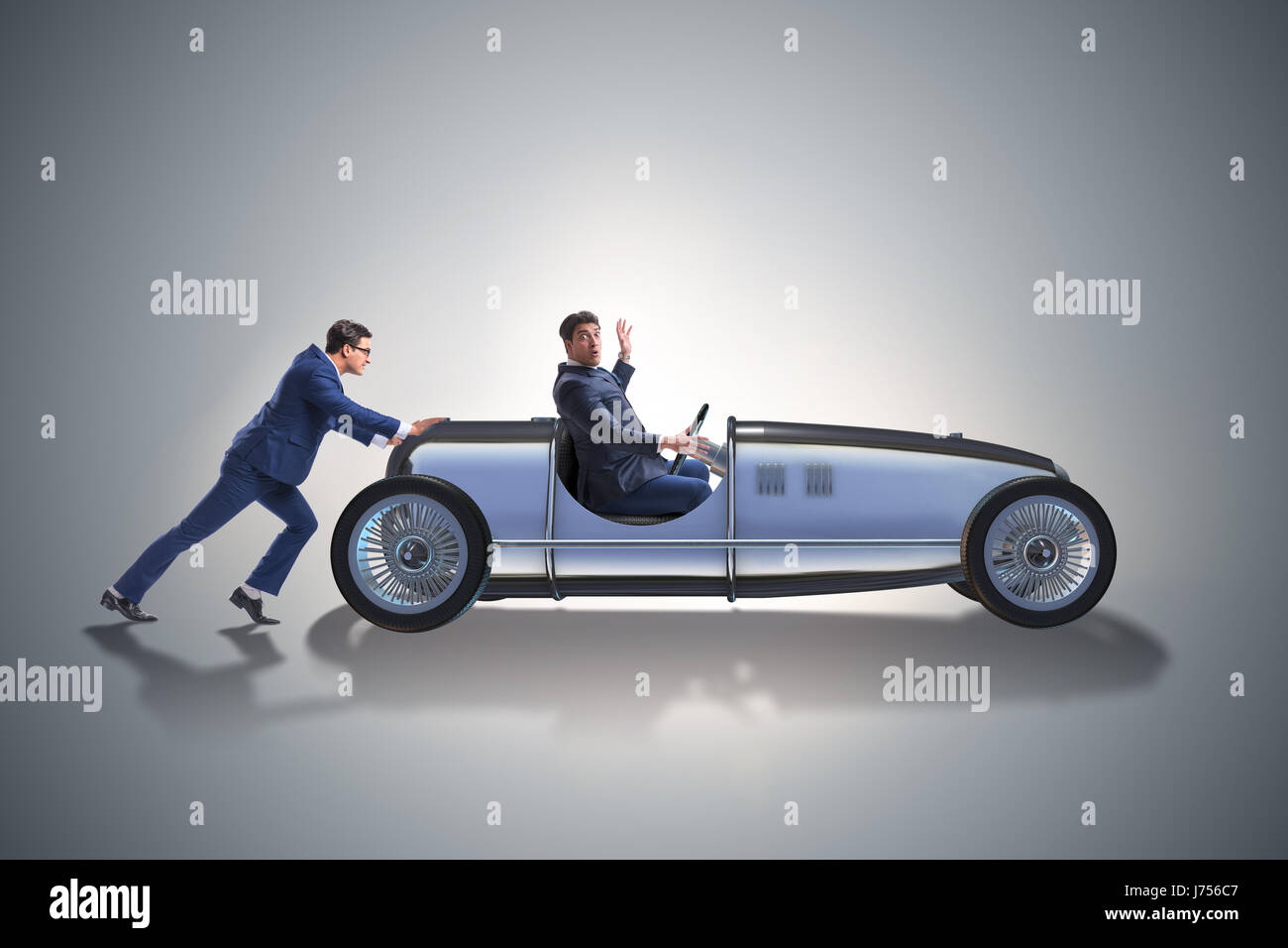 Businessman car pushing in teamwork concept Stock Photo - Alamy
