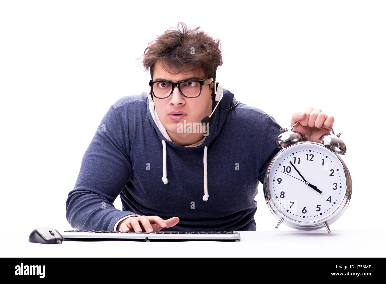 Funny nerd call center operator with giant clock Stock Photo - Alamy