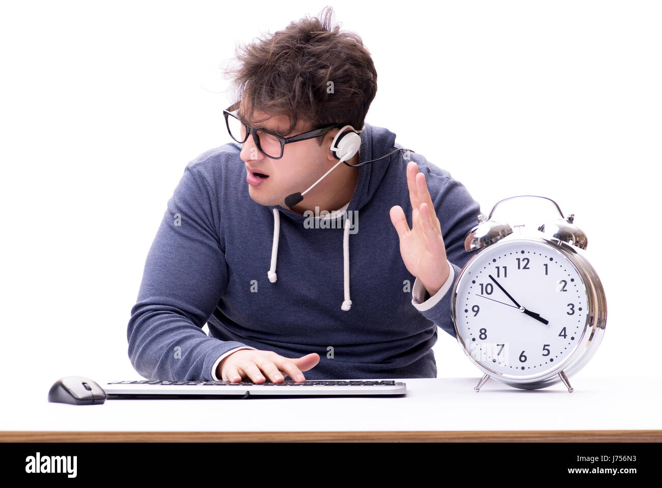 Funny nerd call center operator with giant clock Stock Photo - Alamy