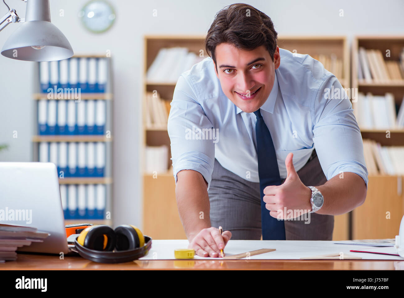 Engineer supervisor working on drawings in the office Stock Photo - Alamy