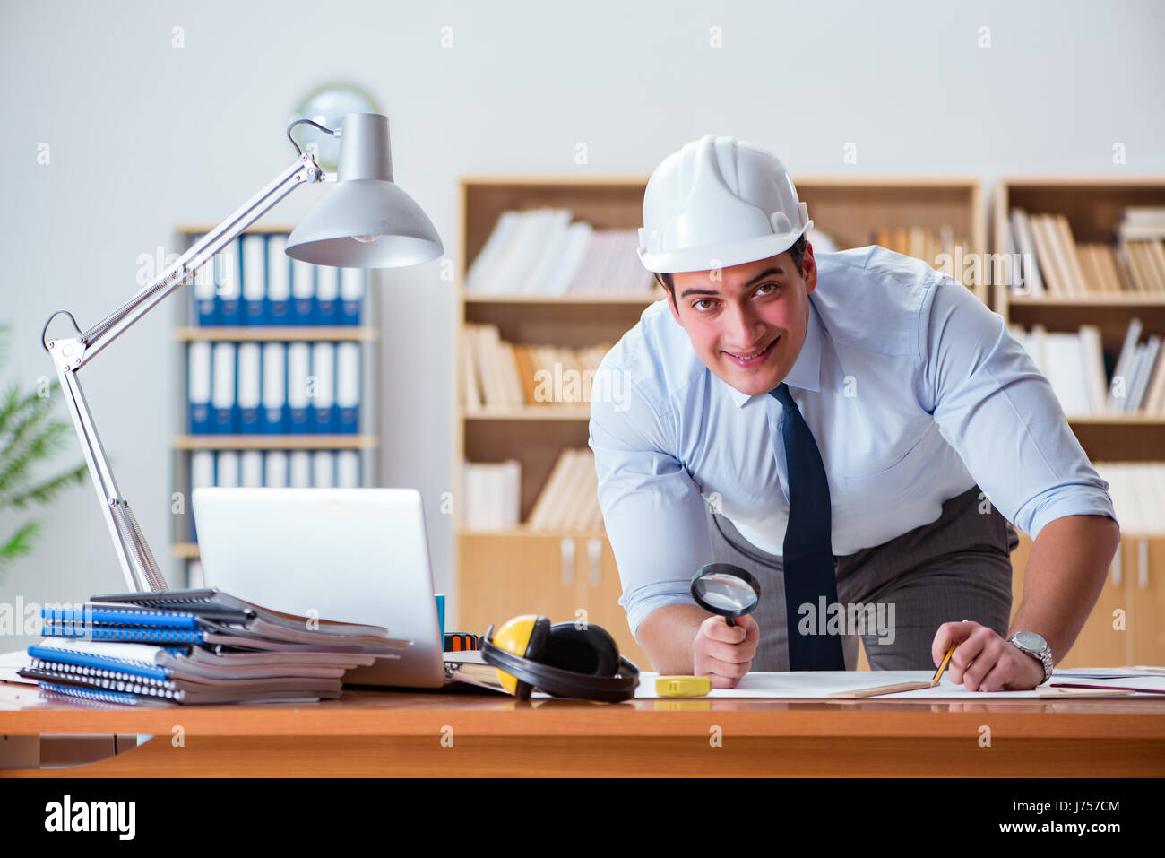 Engineer supervisor working on drawings in the office Stock Photo - Alamy