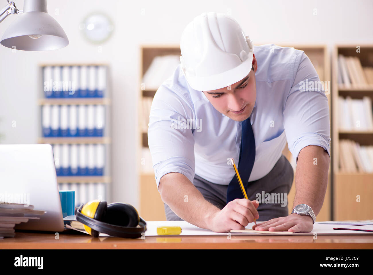 Engineer supervisor working on drawings in the office Stock Photo - Alamy