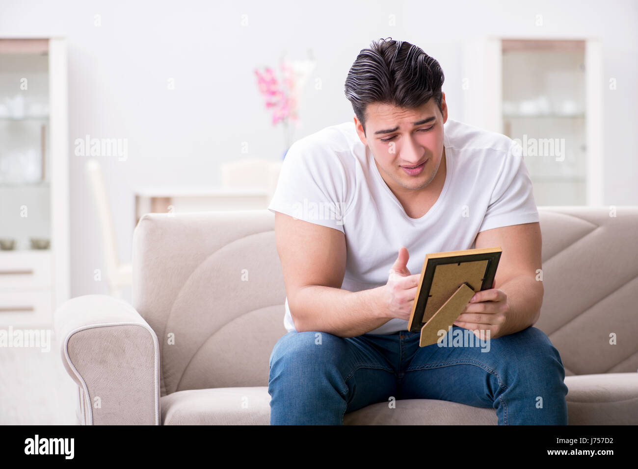 Young man in sad saint valentine concept Stock Photo - Alamy