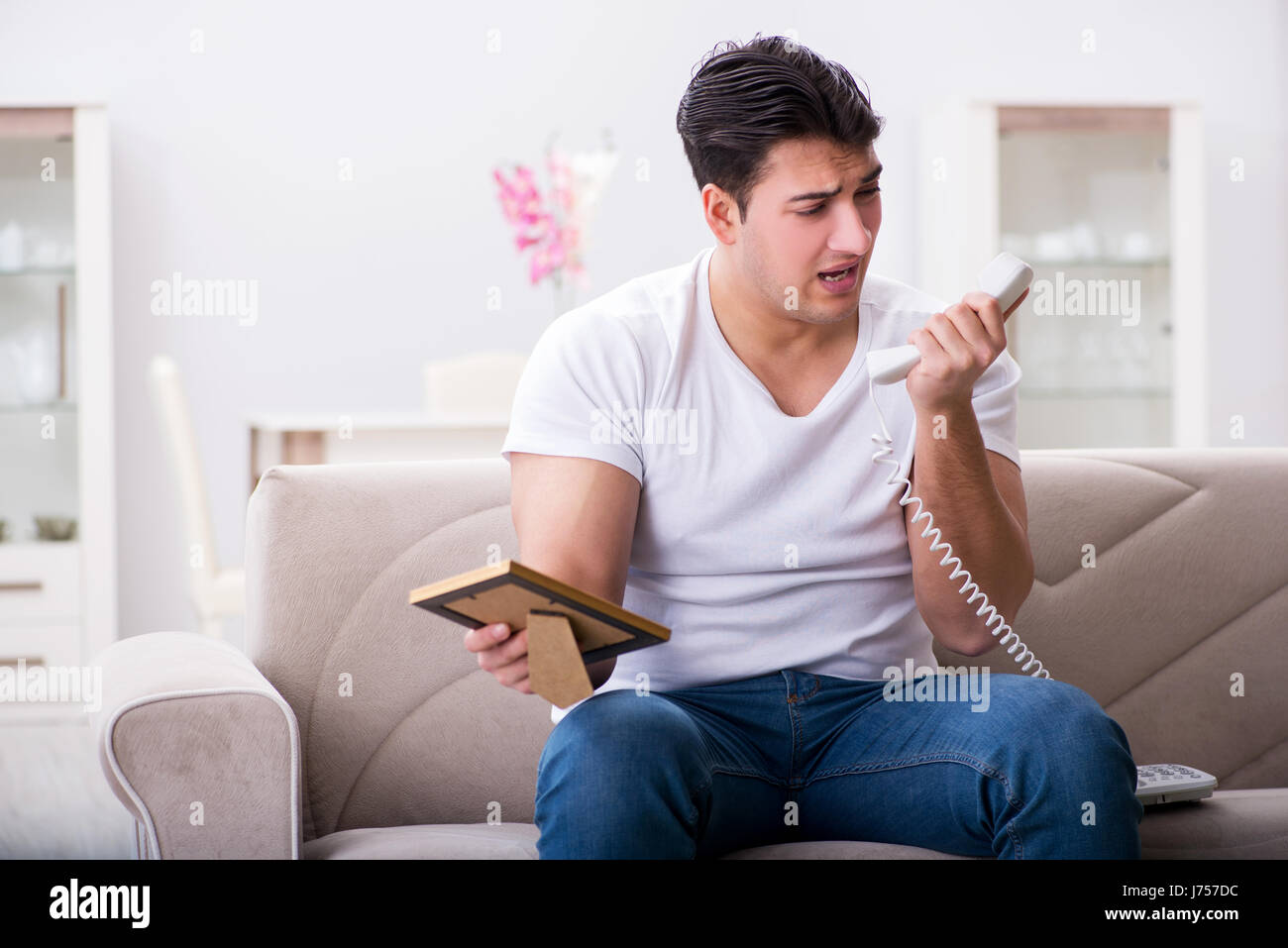 Young man in sad saint valentine concept Stock Photo - Alamy