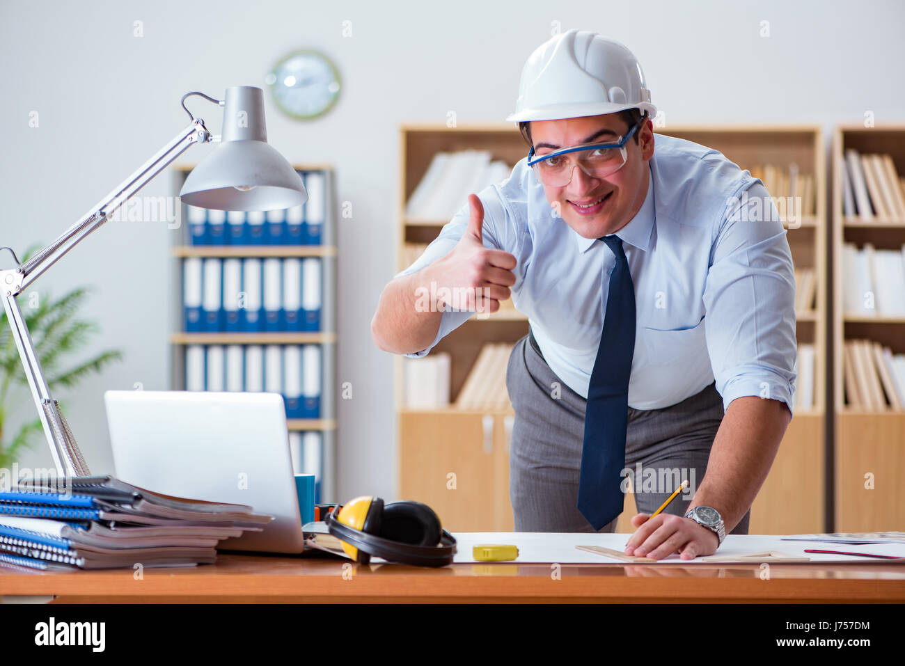 Engineer supervisor working on drawings in the office Stock Photo - Alamy