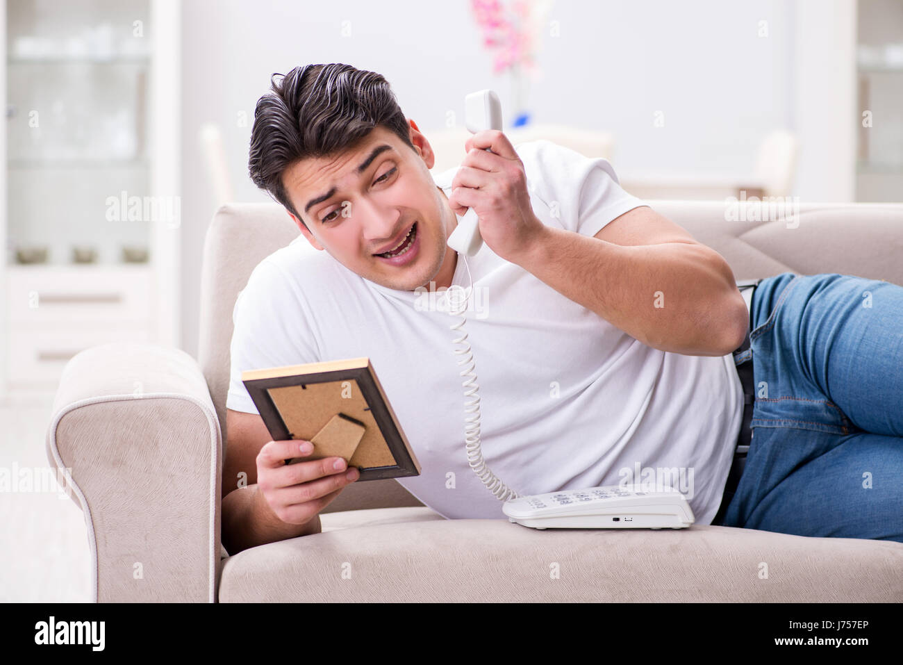Young man in sad saint valentine concept Stock Photo - Alamy