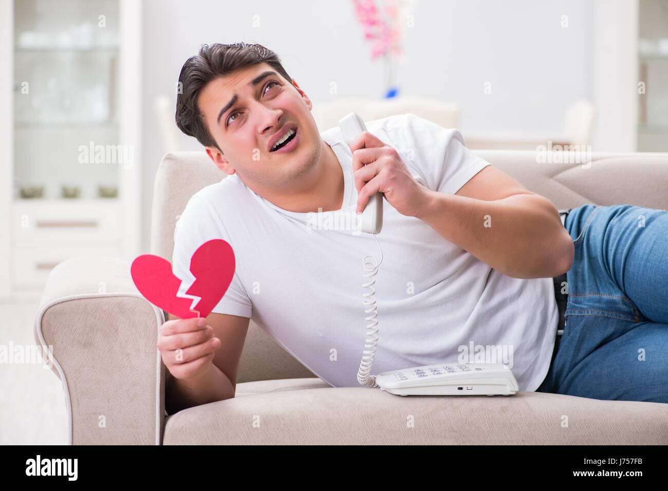 Young man in sad saint valentine concept Stock Photo - Alamy