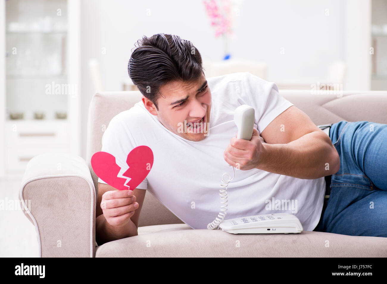Young man in sad saint valentine concept Stock Photo - Alamy