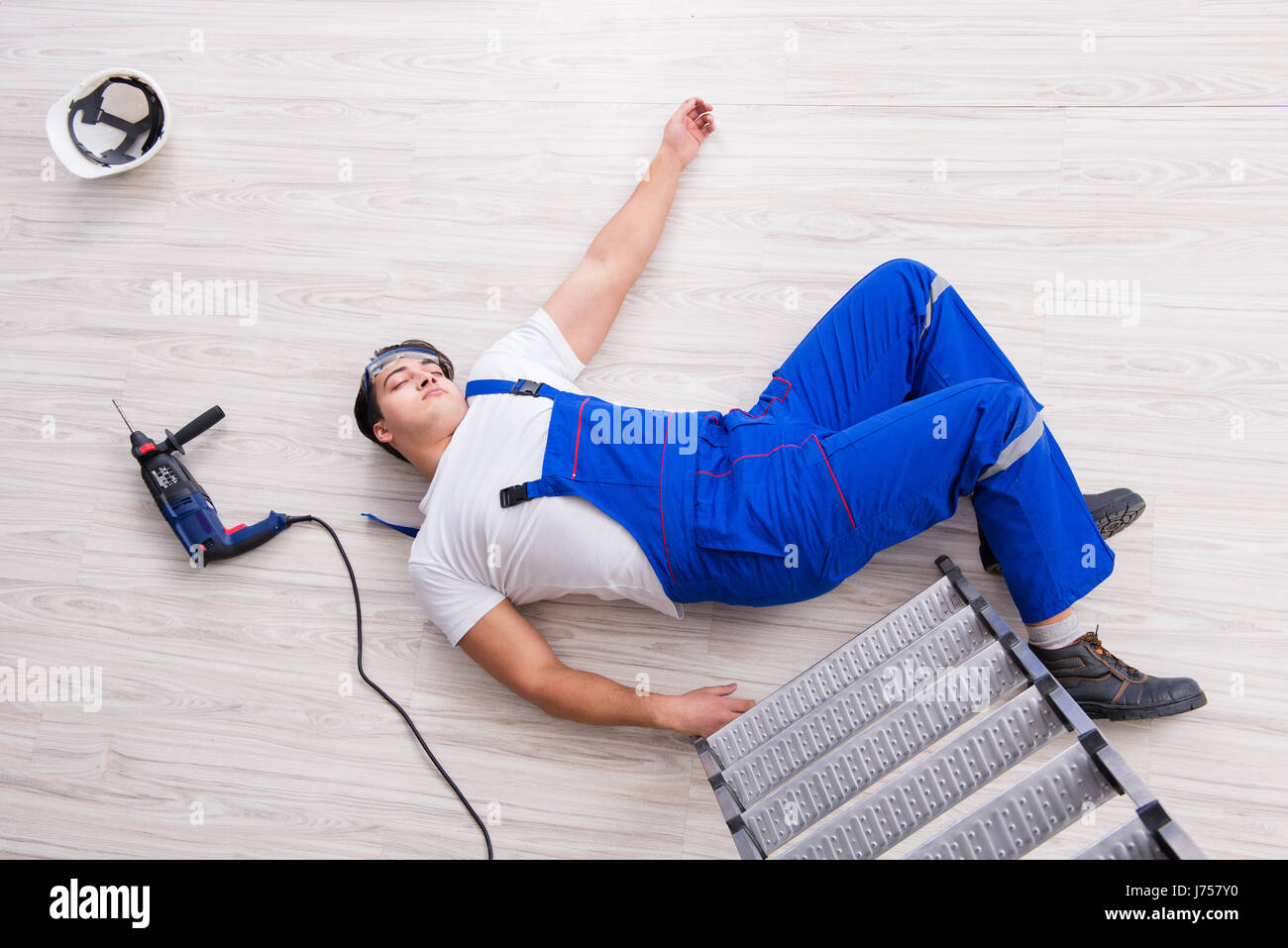 Worker after falling from height - unsafe behavior Stock Photo - Alamy
