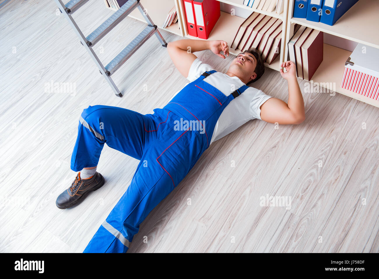 Unsafe behavior concept with falling worker Stock Photo - Alamy
