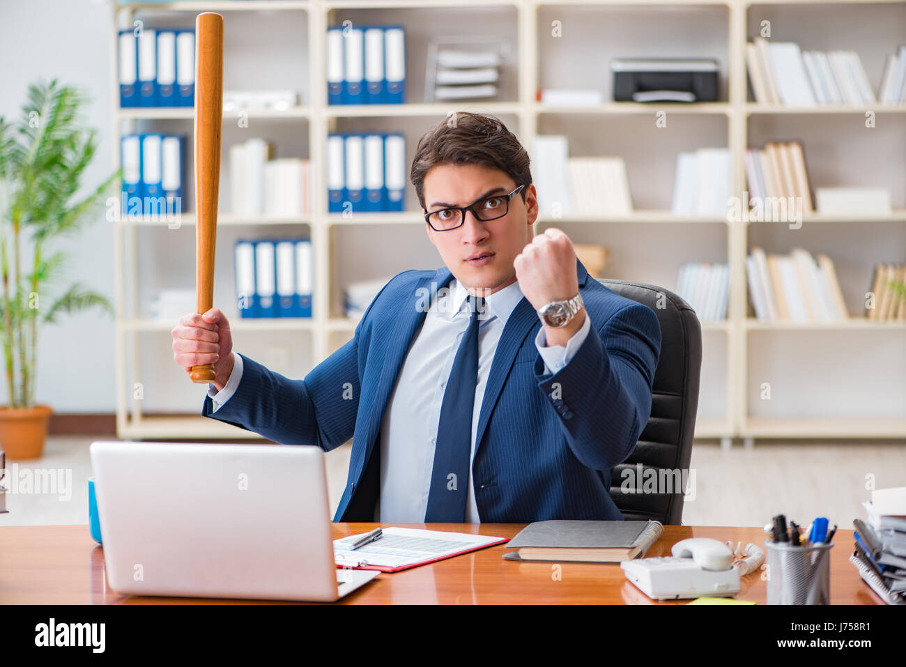 Angry aggressive businessman in the office Stock Photo - Alamy