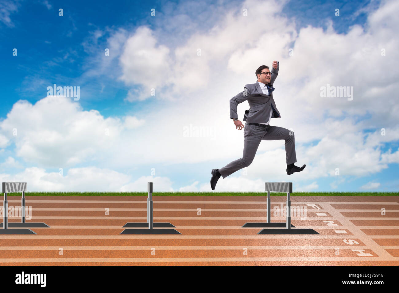 Businessman jumping over barriers hi-res stock photography and images ...
