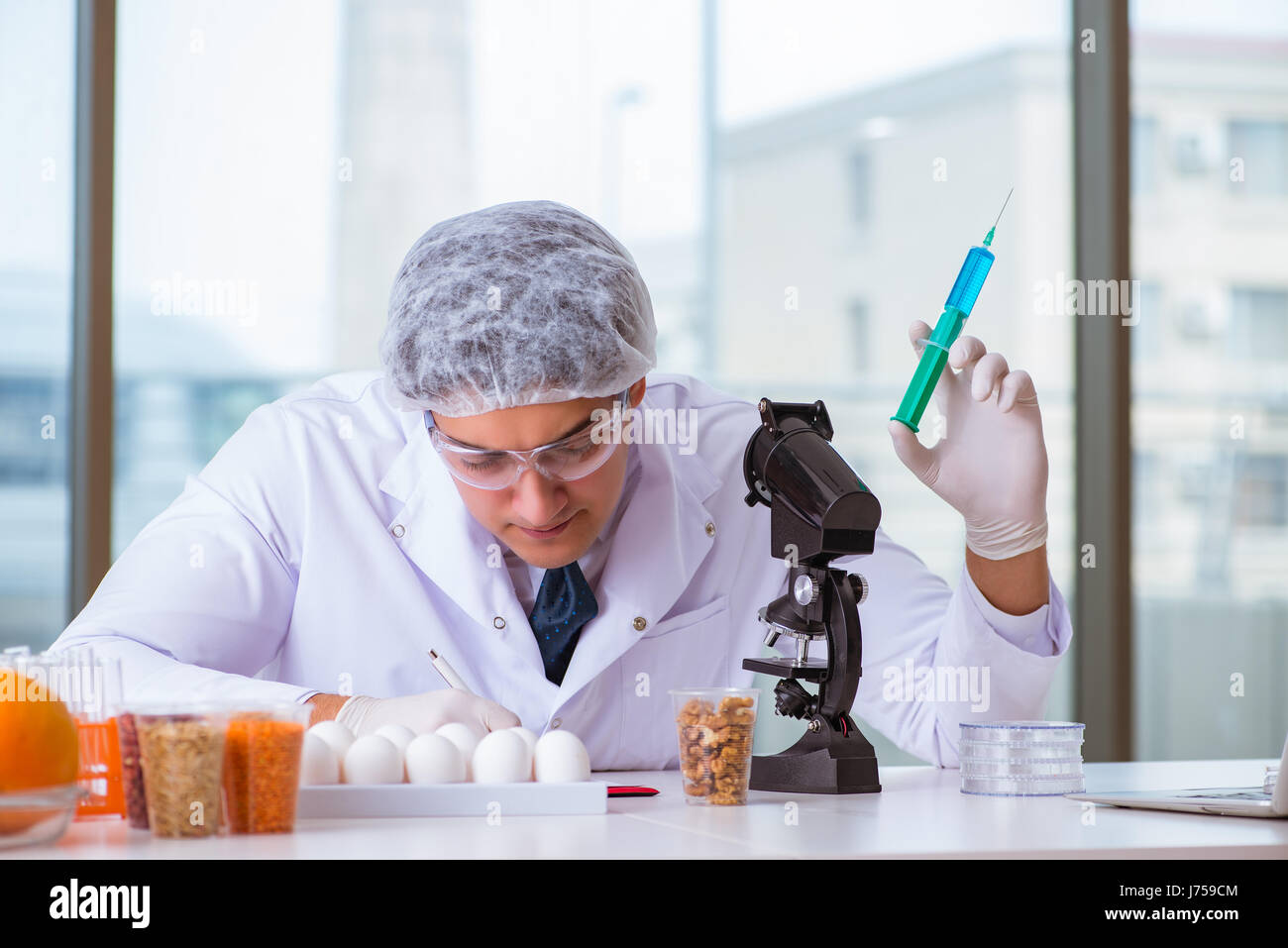 Nutrition expert testing food products in lab Stock Photo - Alamy