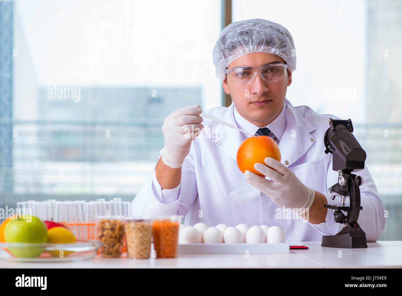 Nutrition expert testing food products in lab Stock Photo - Alamy