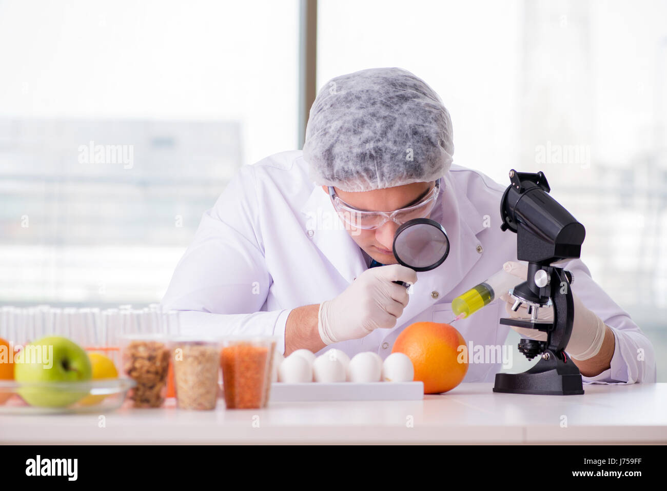 Nutrition expert testing food products in lab Stock Photo - Alamy
