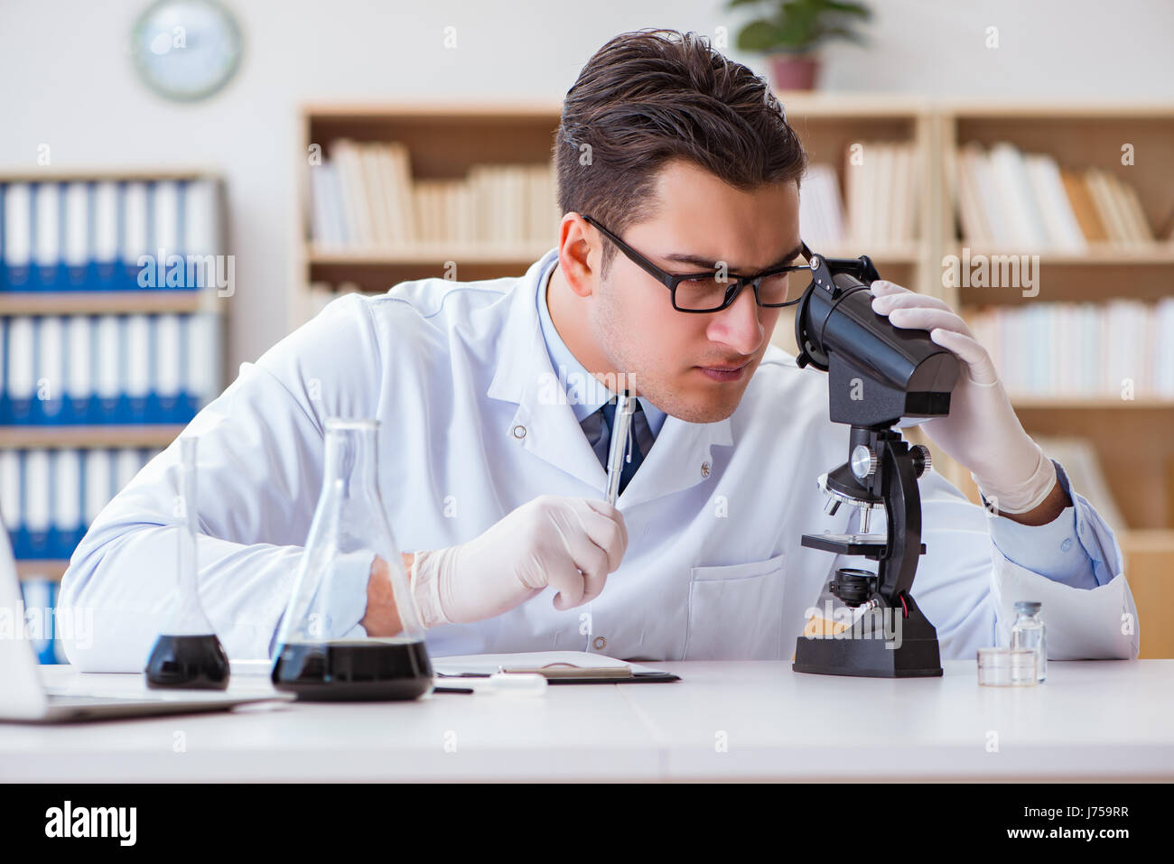 Chemical engineer working on oil samples in lab Stock Photo - Alamy