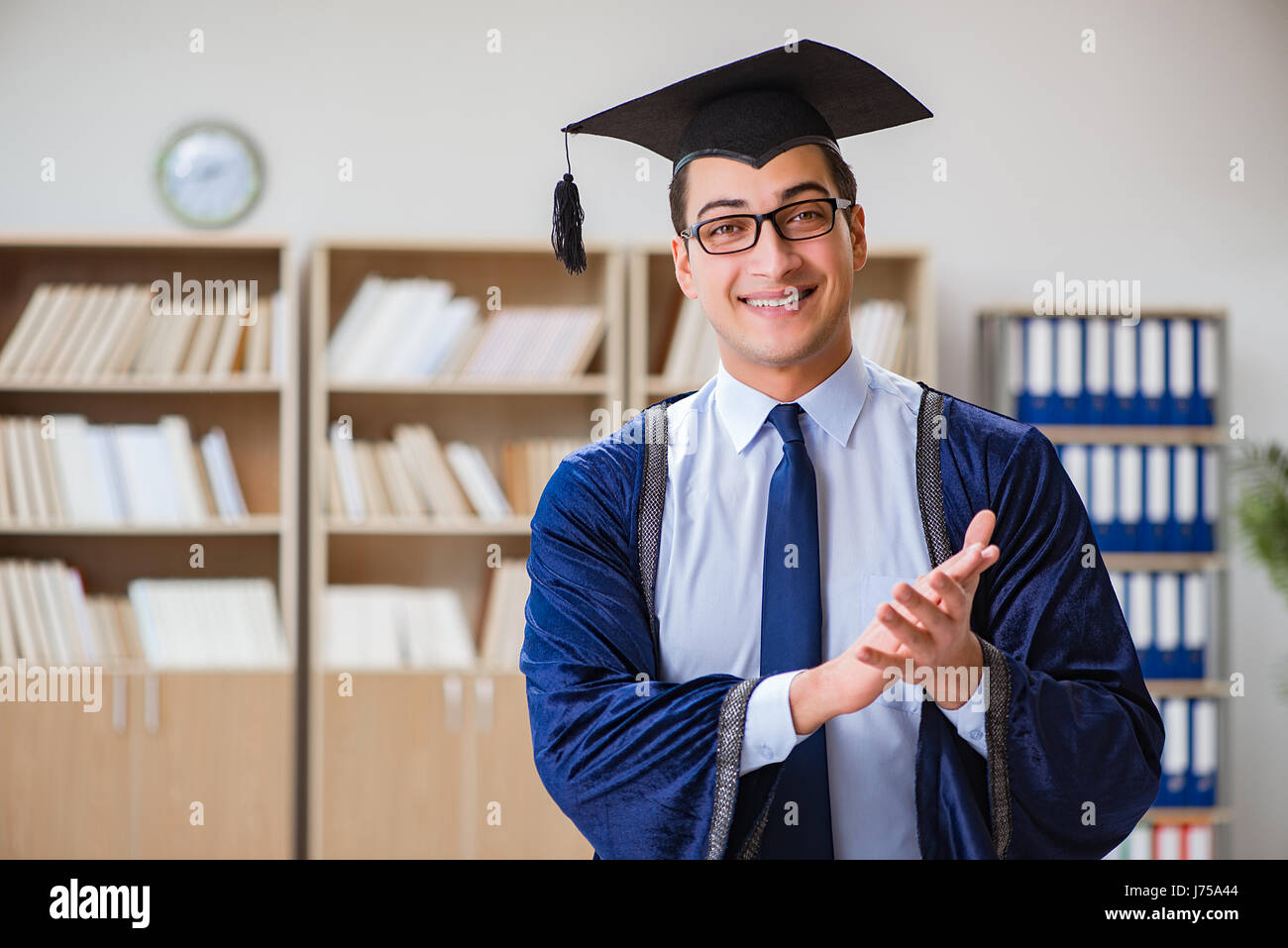 Young man graduating from university Stock Photo - Alamy
