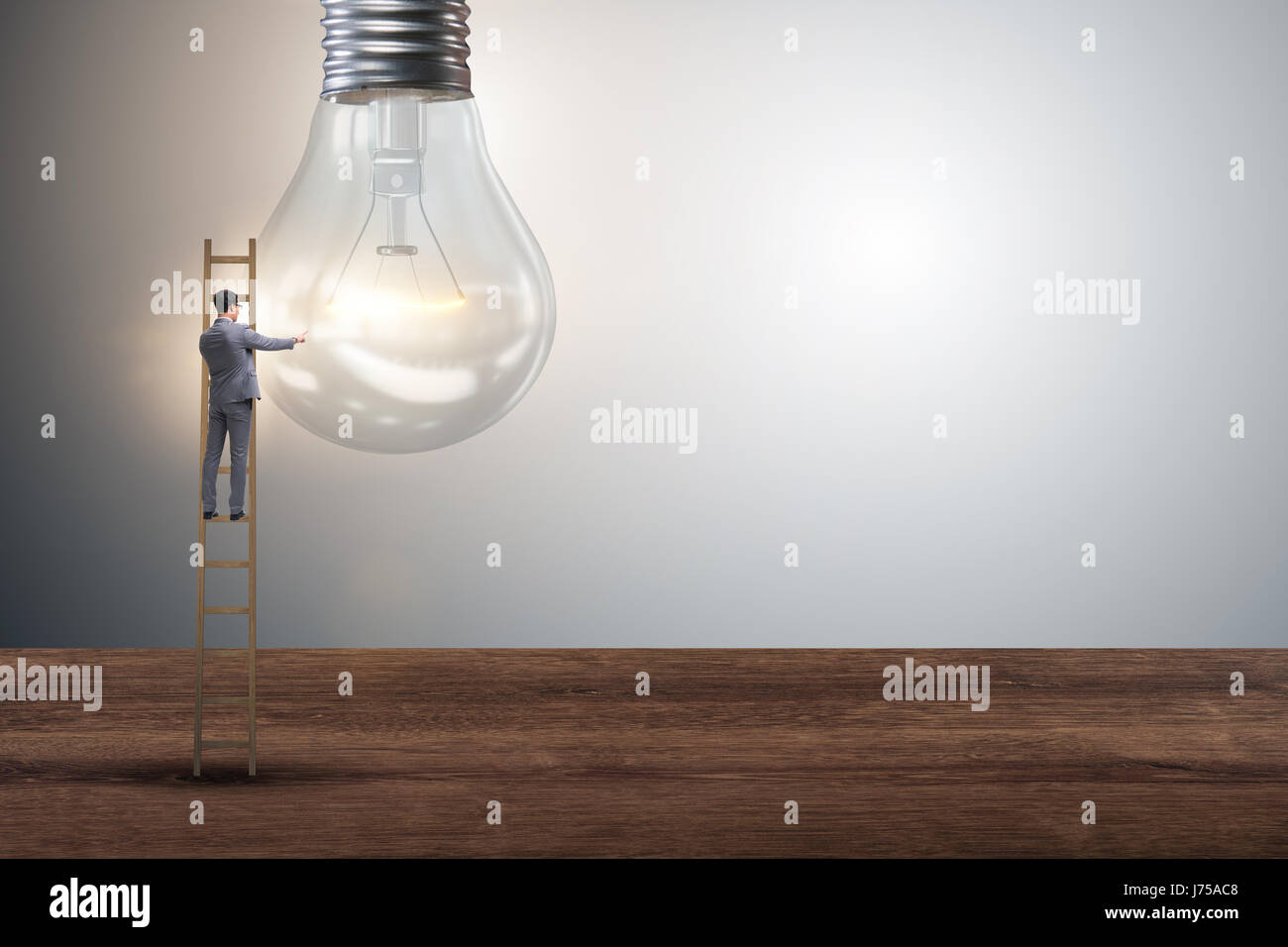 Businessman on ladder with light bulb Stock Photo - Alamy