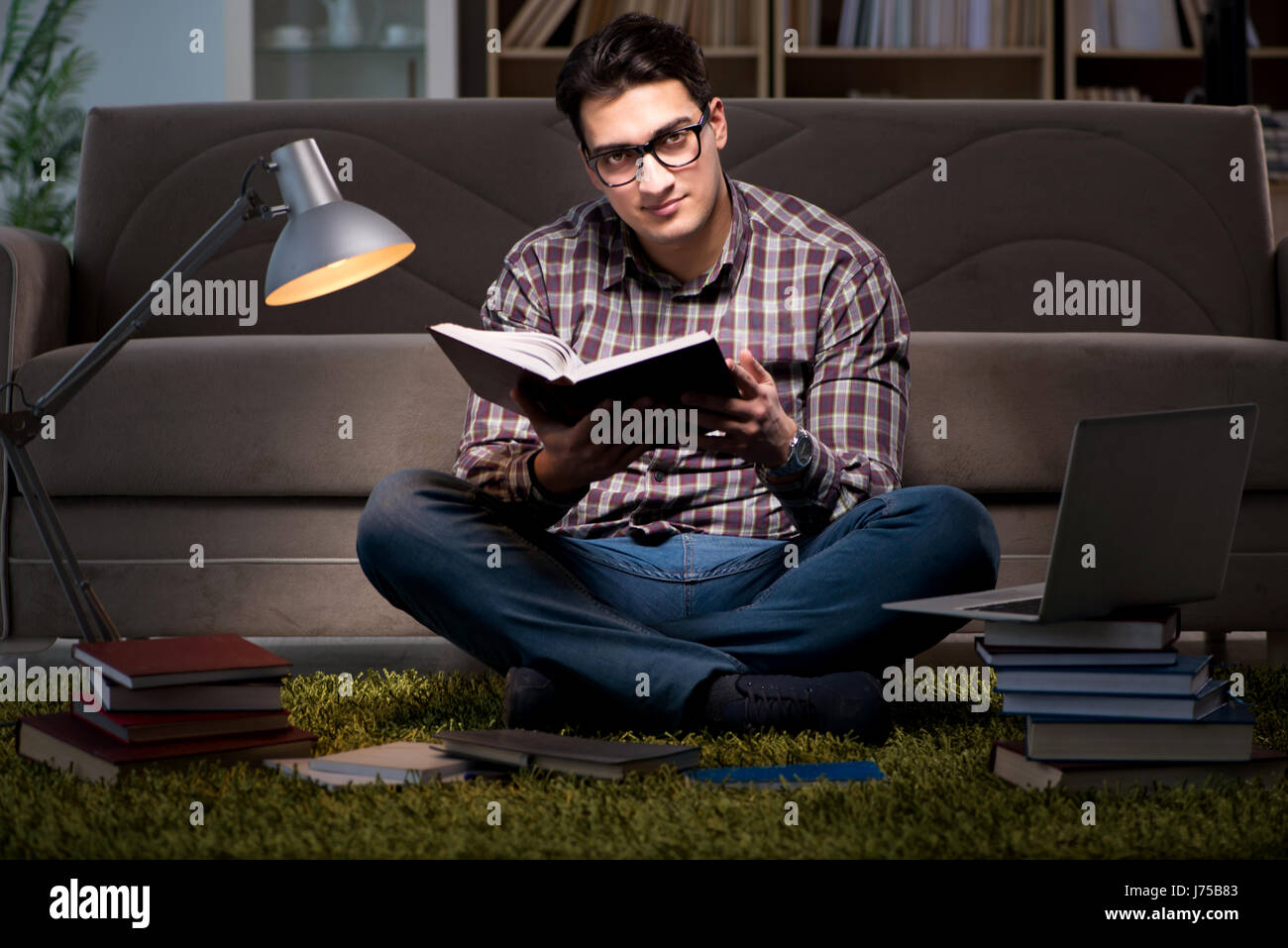 Student reading books preparing for exams Stock Photo - Alamy