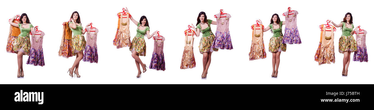 Woman trying to choose dress on white Stock Photo - Alamy