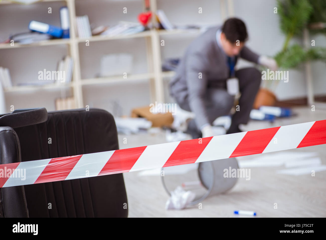 Young man during crime investigation in office Stock Photo - Alamy