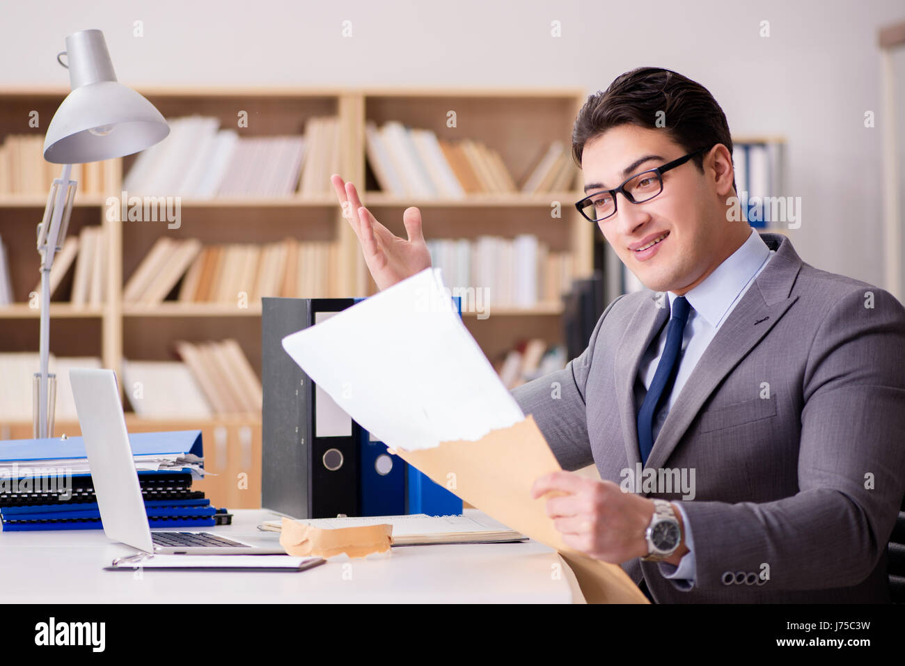 Businessman receiving letter in the office Stock Photo - Alamy