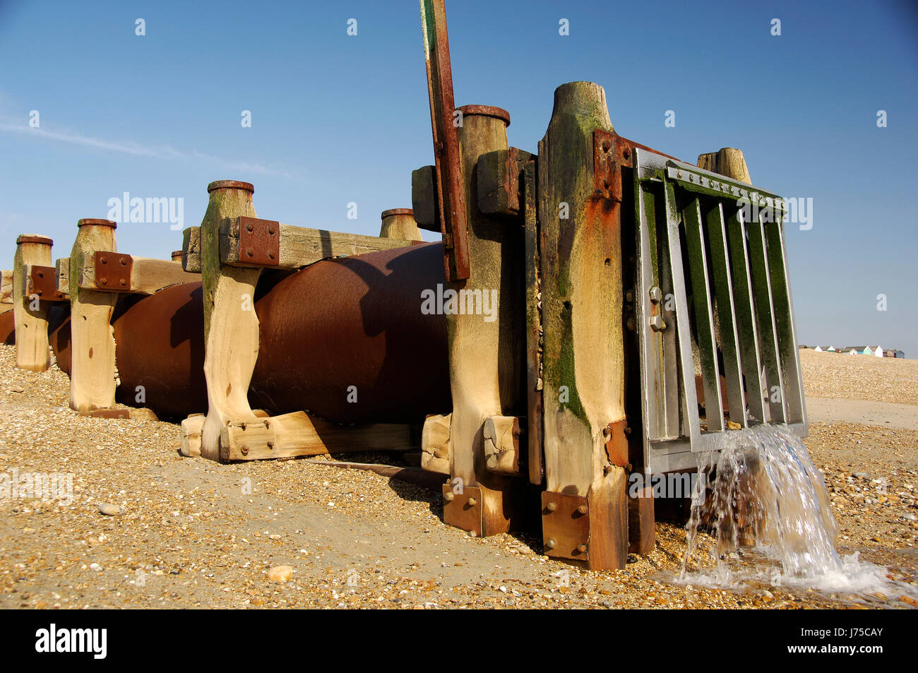 Sewage outflow pipe on a pebble beach Stock Photo - Alamy