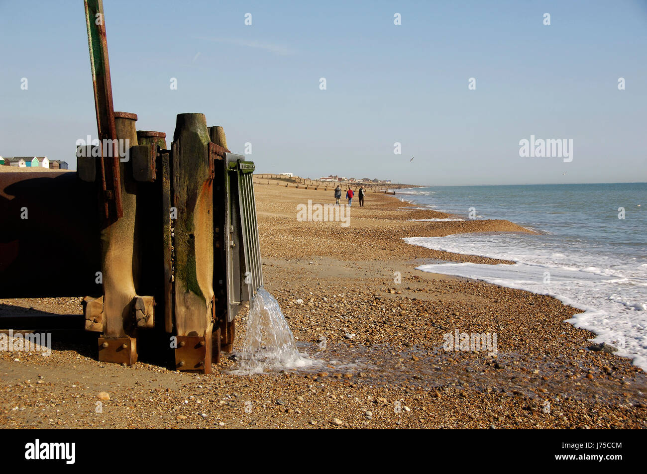 Sewage outflow pipe on a pebble beach Stock Photo - Alamy