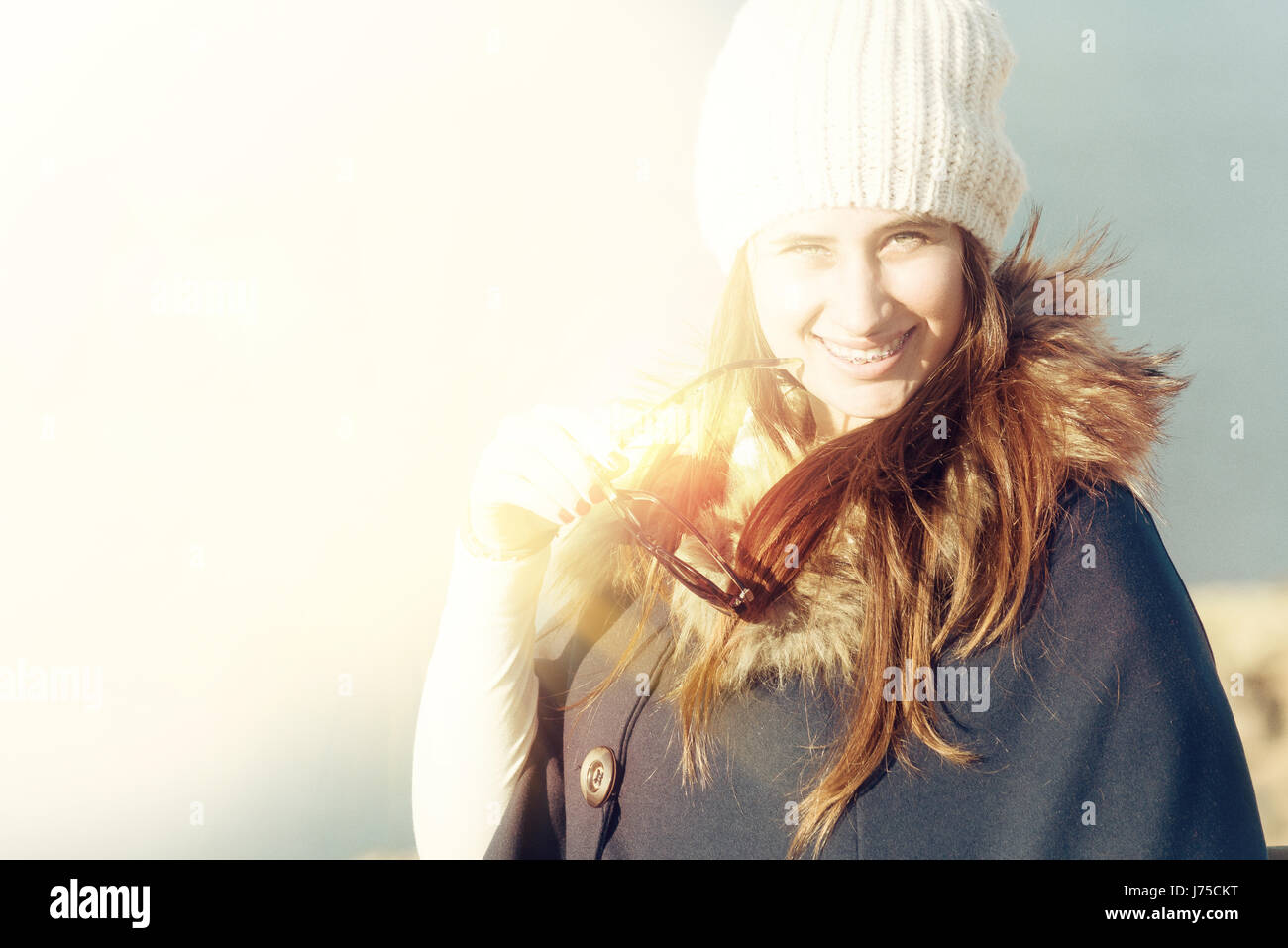 Beautiful and happy young girl posing outdoors Stock Photo - Alamy