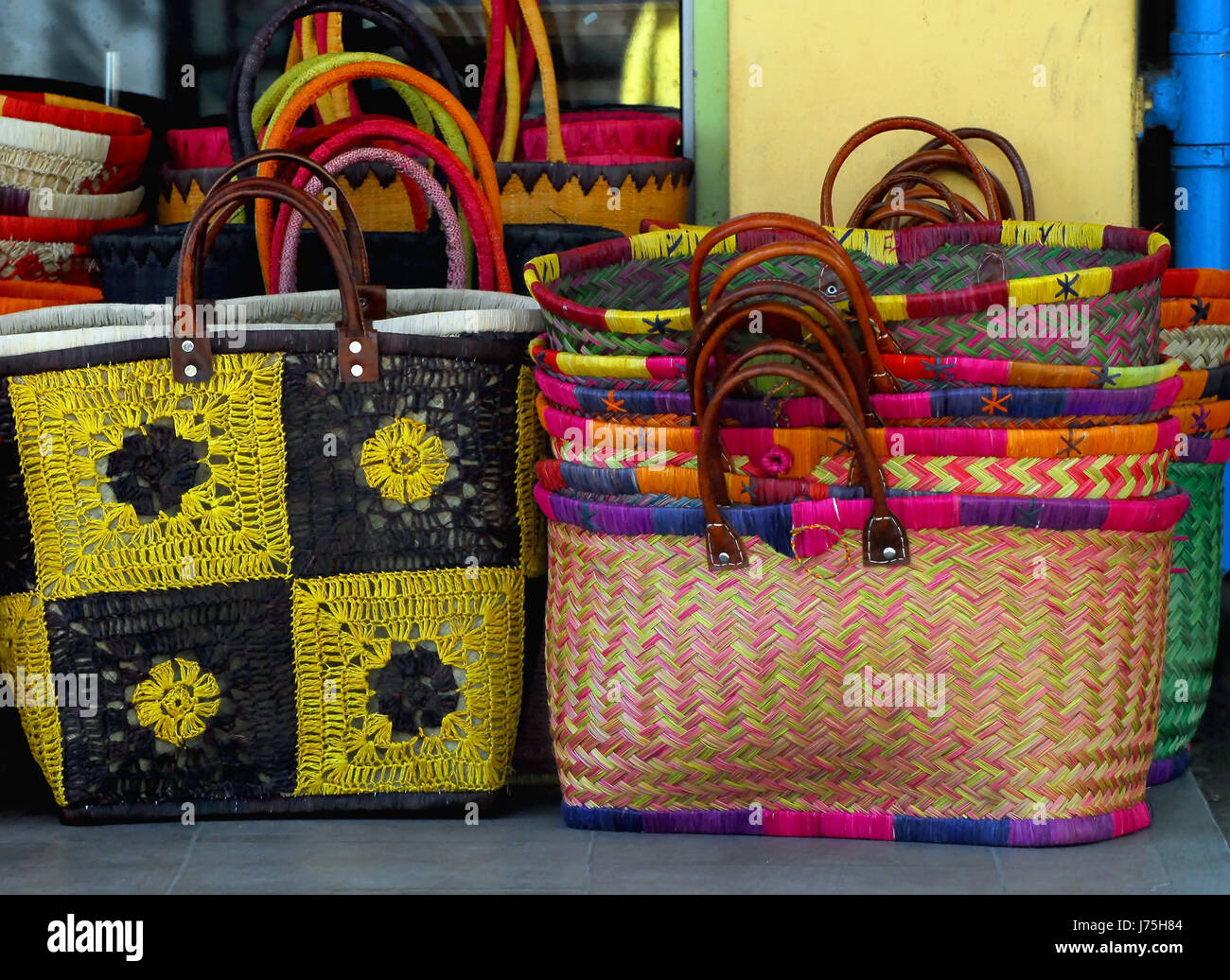 from palm leaves hand-woven bags Stock Photo - Alamy