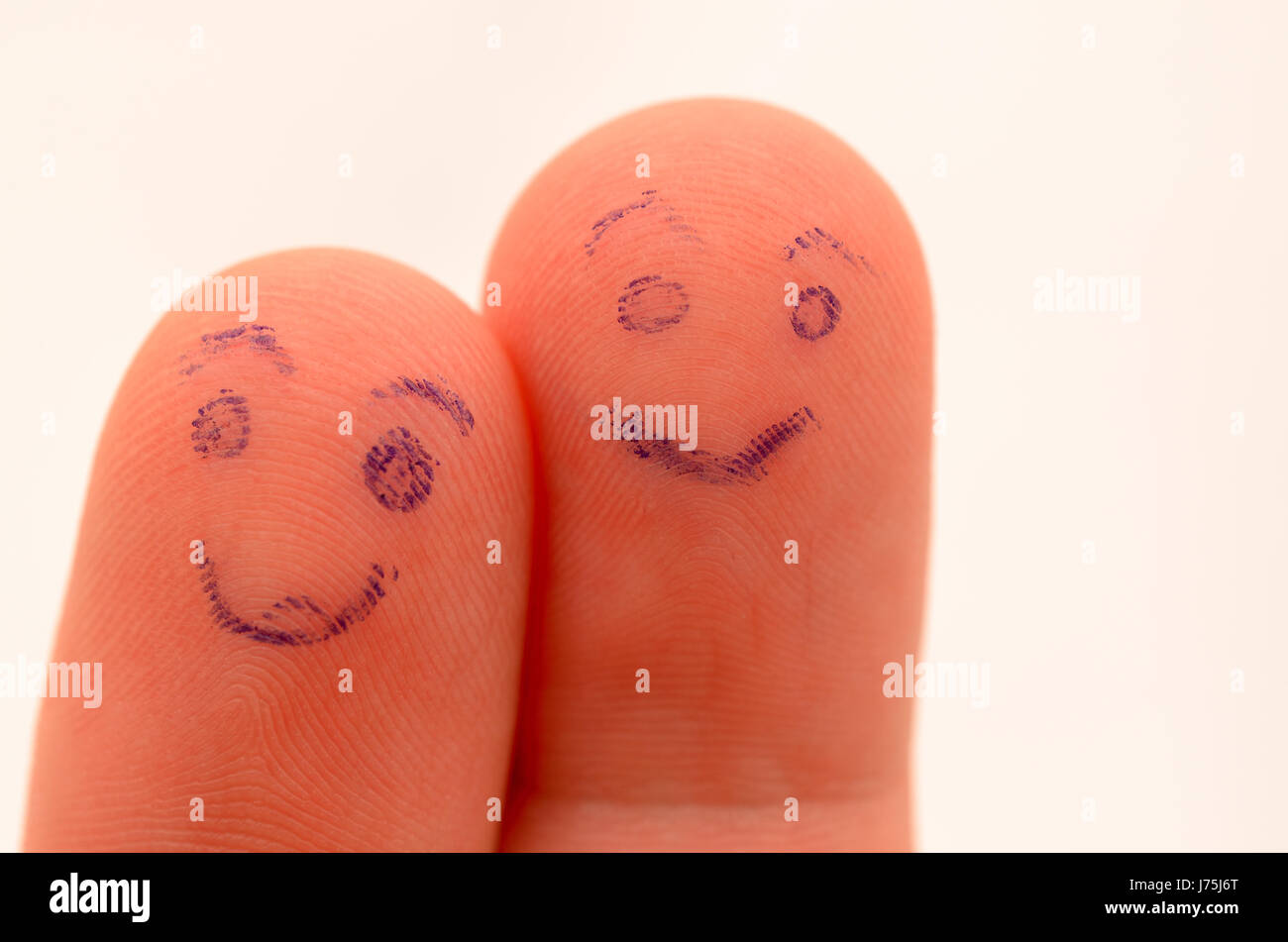 Drawing funny faces on fingers by April 1st Stock Photo - Alamy