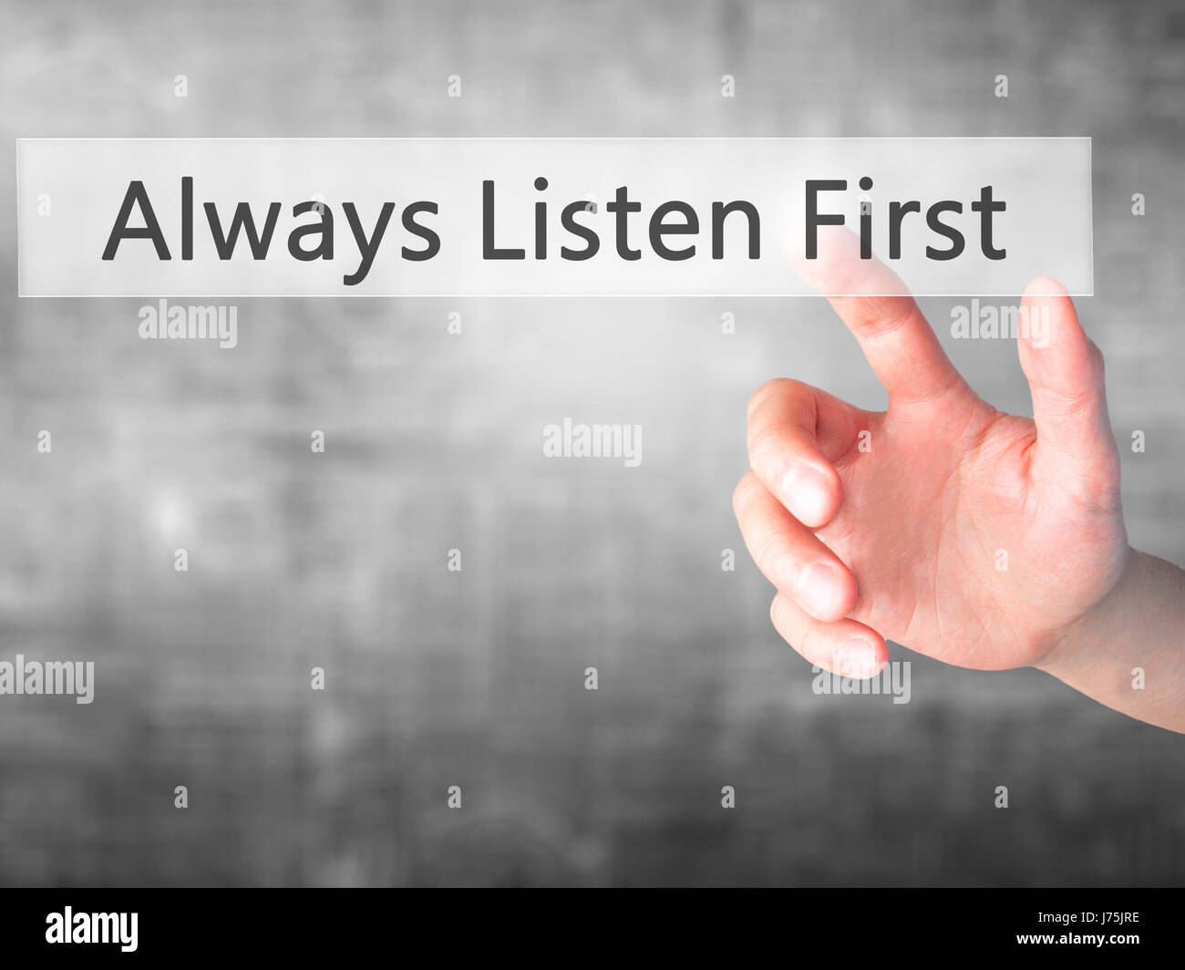Always Listen First - Hand pressing a button on blurred background ...