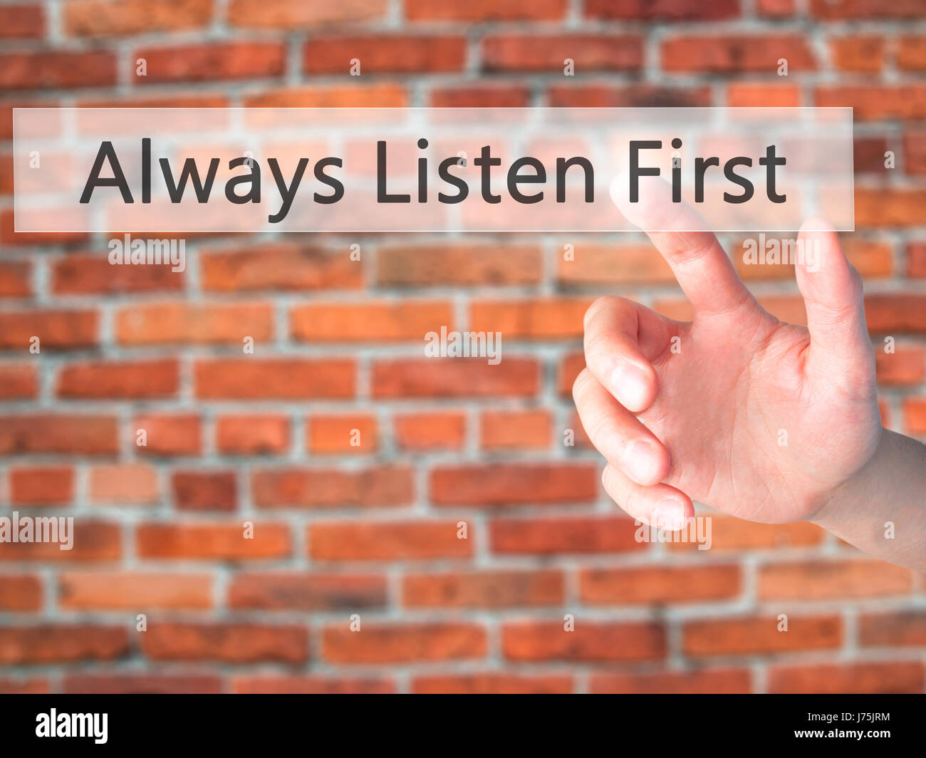 Always Listen First - Hand pressing a button on blurred background ...