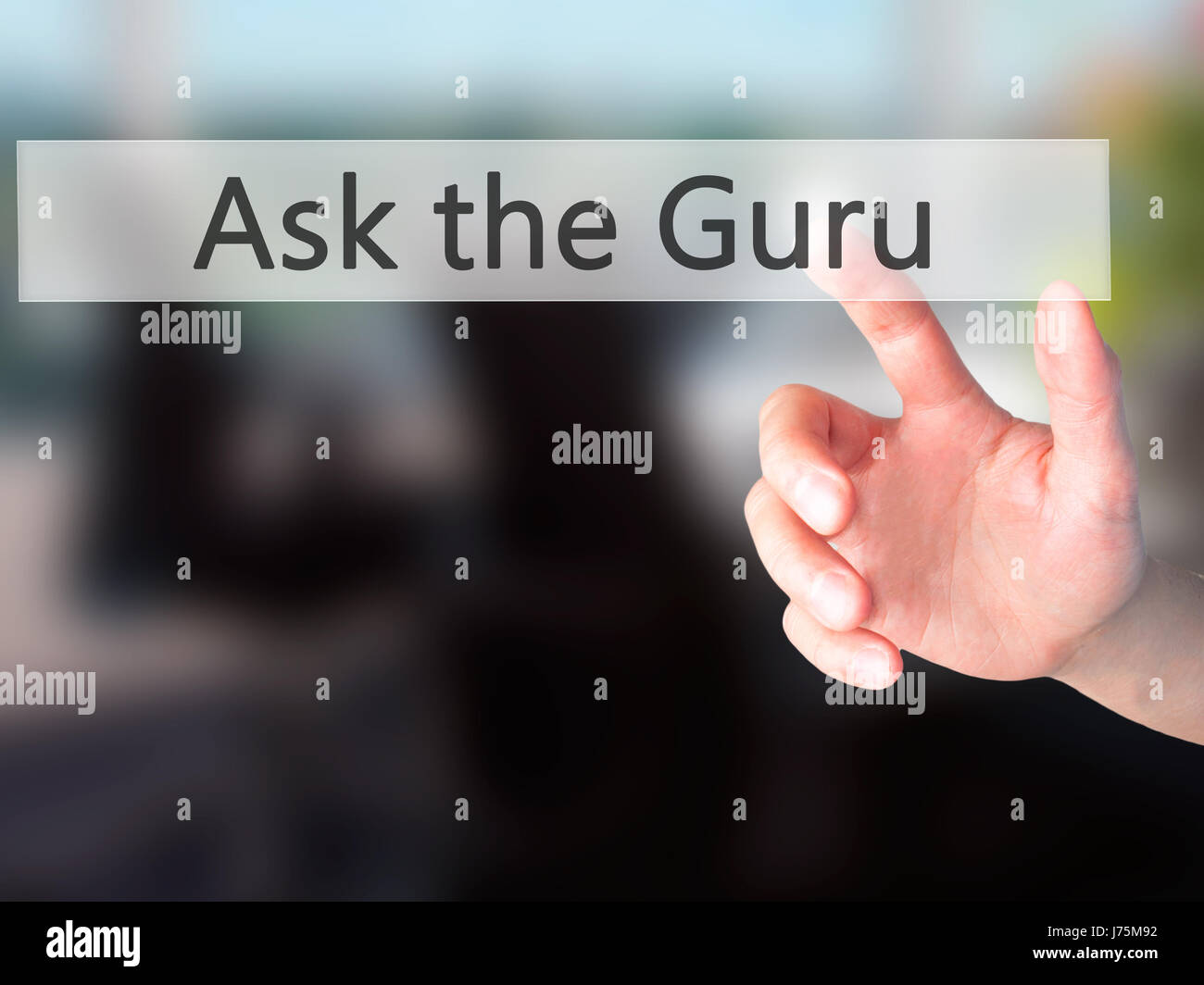 Ask the Guru - Hand pressing a button on blurred background concept ...