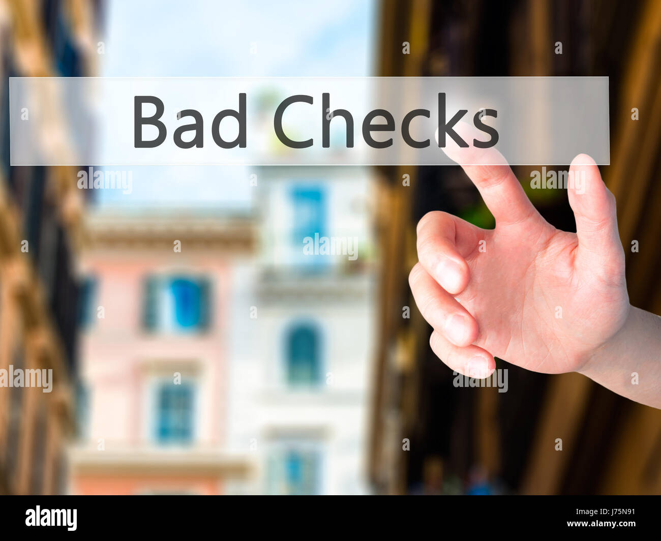 Bad Checks - Hand pressing a button on blurred background concept ...