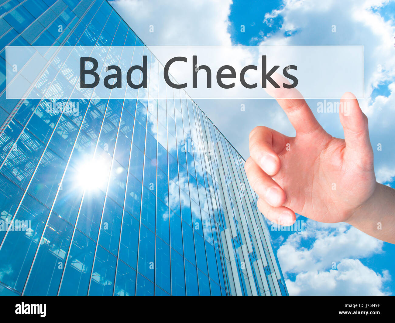 Bad Checks - Hand pressing a button on blurred background concept ...