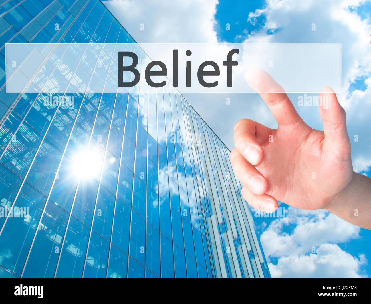 Belief - Hand pressing a button on blurred background concept ...