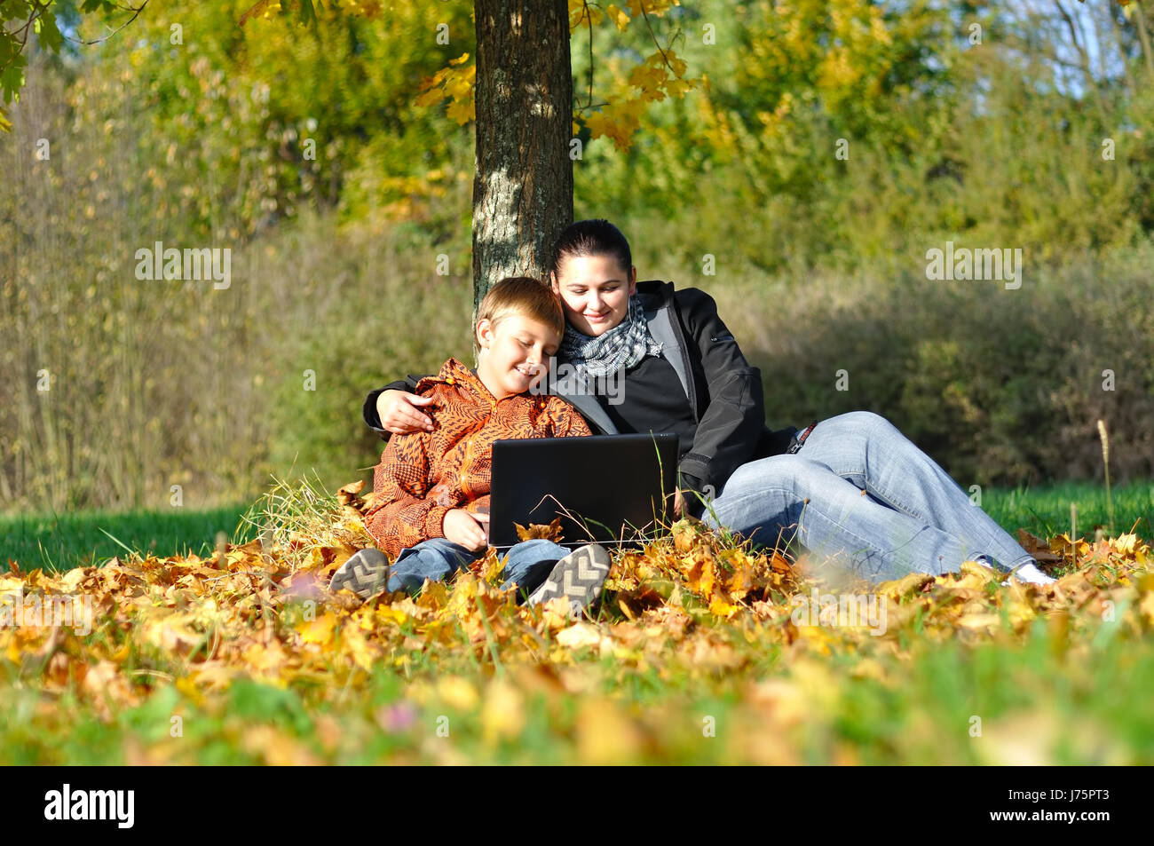 woman laptop notebook computers computer kid boy lad male youngster ...