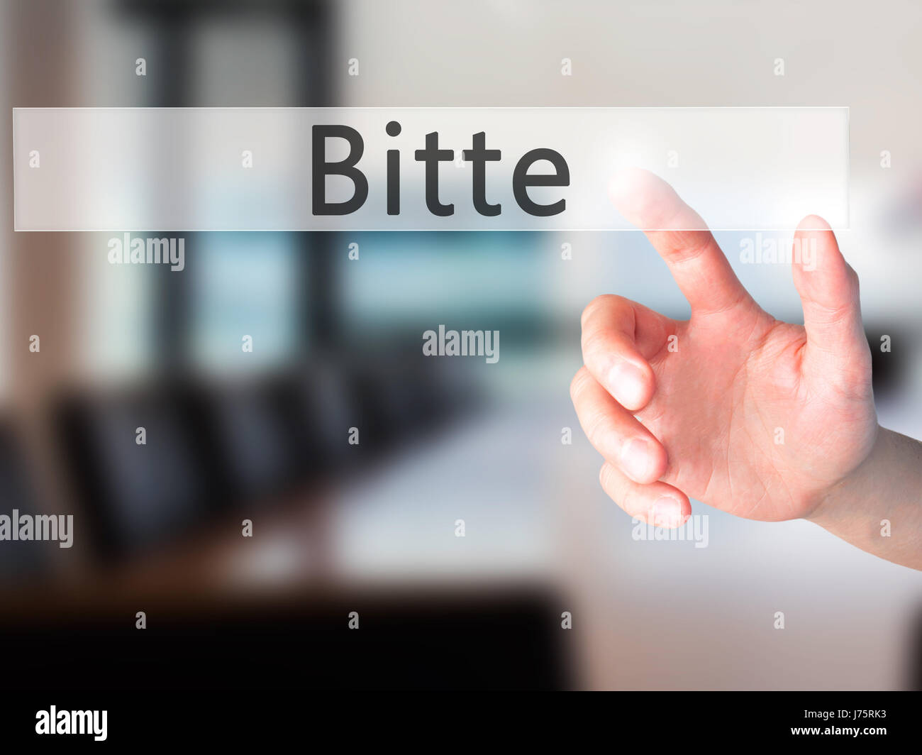 Bitte (Please in German) - Hand pressing a button on blurred background ...